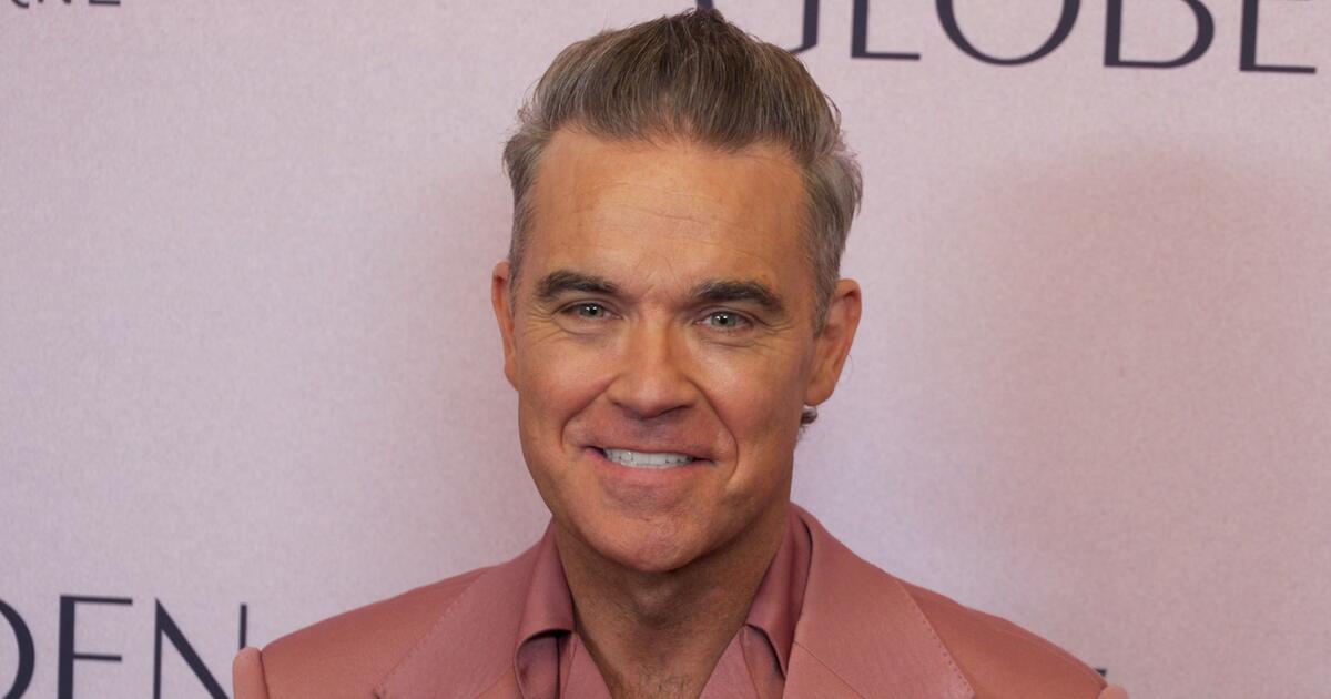 Robbie Williams zeigt seine neuen Zähne - Video | GMX